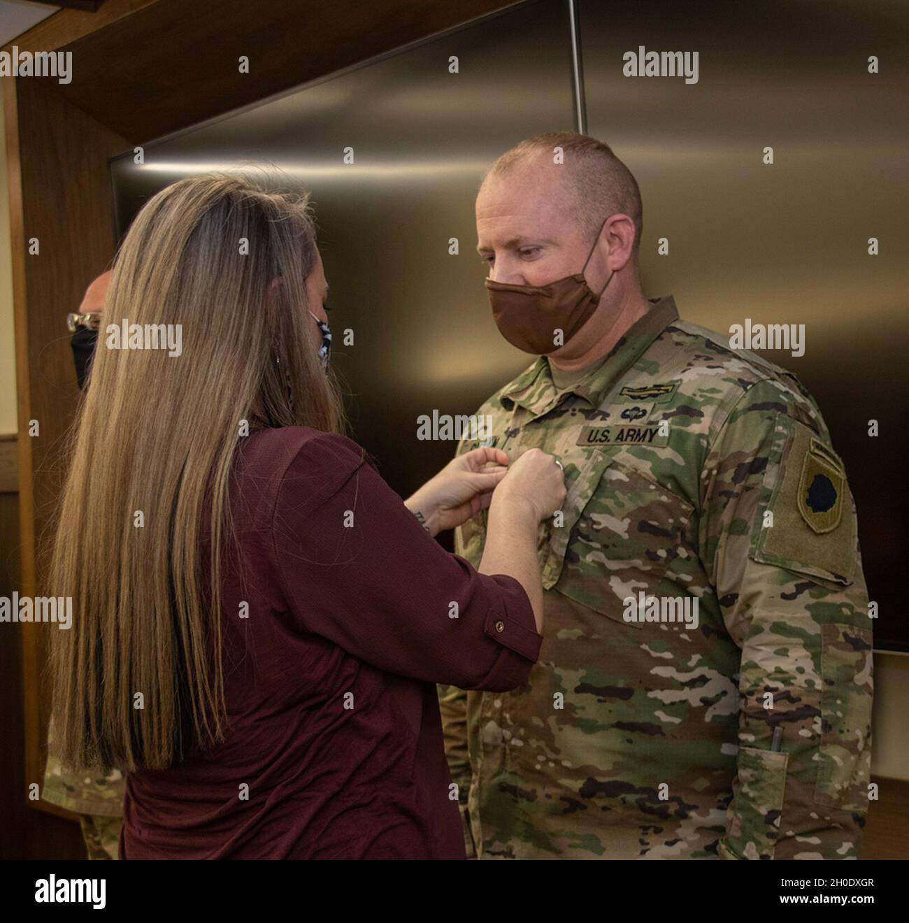 Newly promoted Lt. Col. Scott Gilman’s wife, Lillian, places his new ...