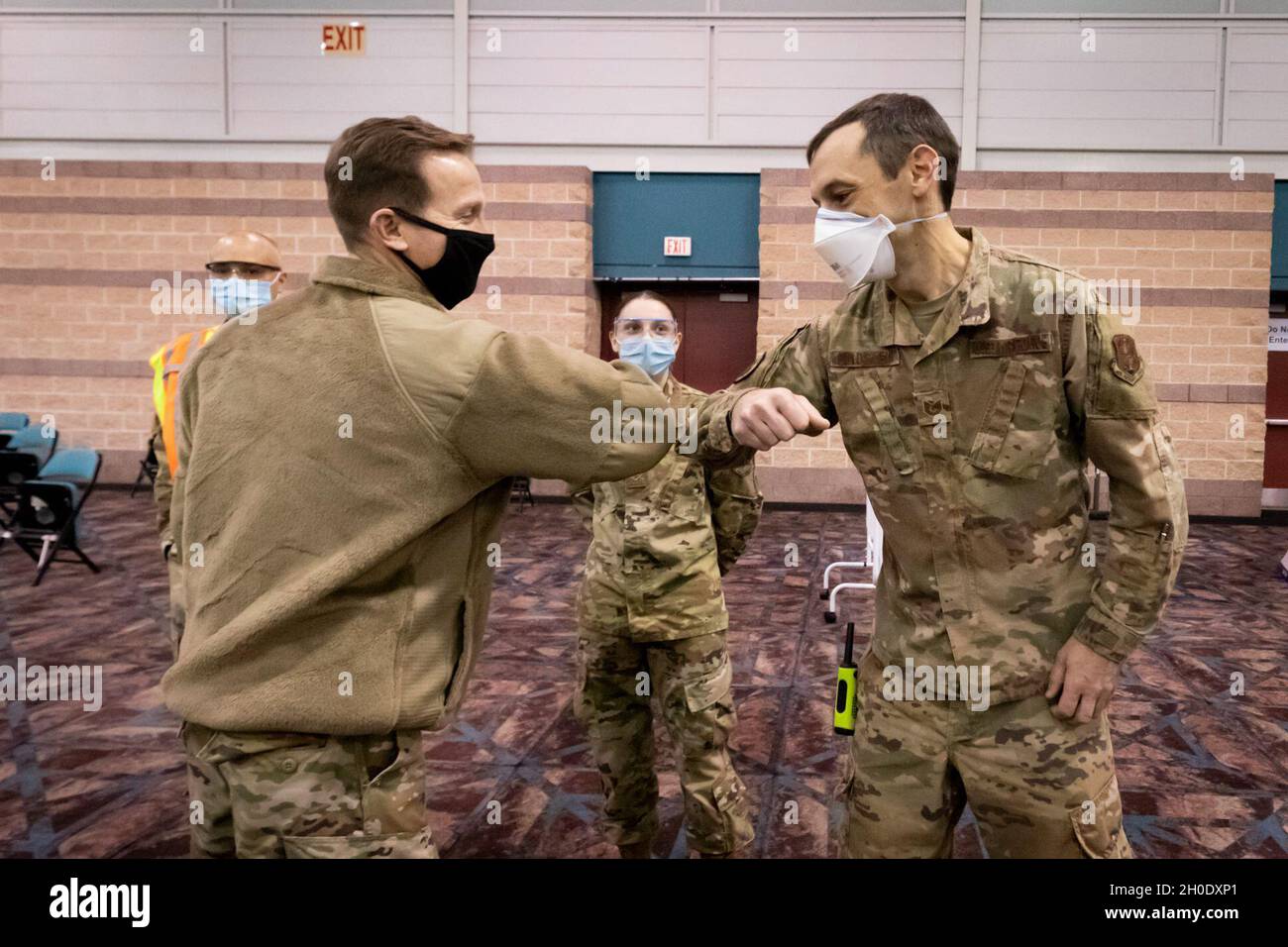 108th Wing Commander Col. John Cosgrove, left, bumps elbows with Tech ...