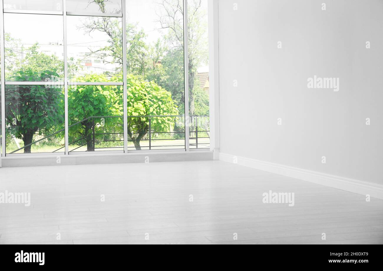 Living room with big beautiful window. Interior design Stock Photo - Alamy