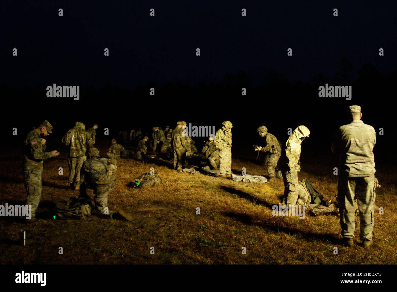 U.S. Army Soldiers conduct a functions check following a 12-mile ruck ...