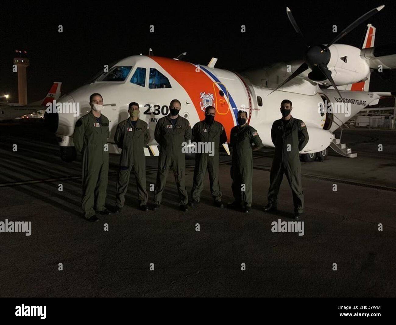 Coast Guard Air Station Miami HC-144 Ocean Sentry aircrew pose for a ...