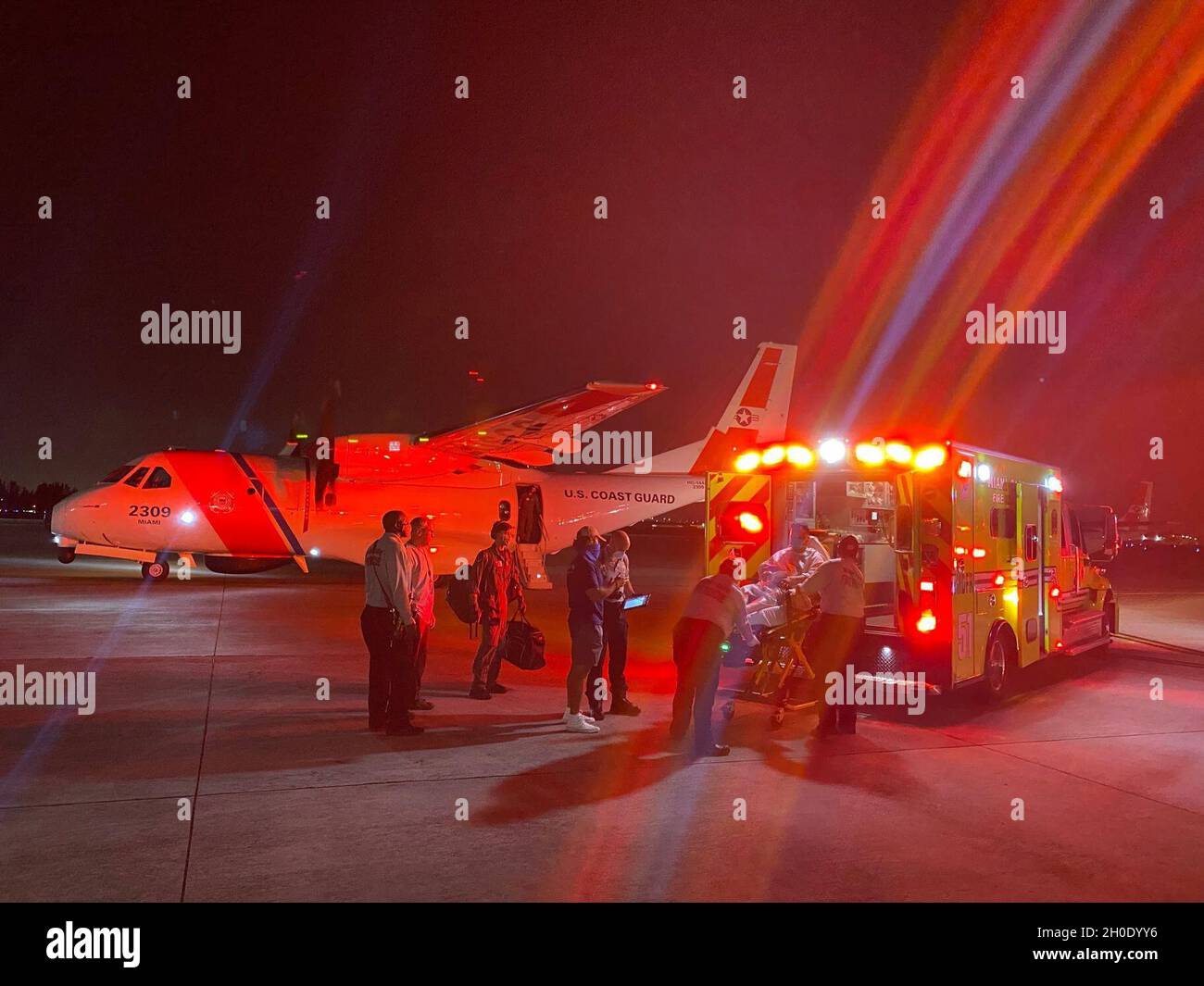 U.S. Coast Guard aircrew transfer injured man to Miami-Dade Fire Rescue ...