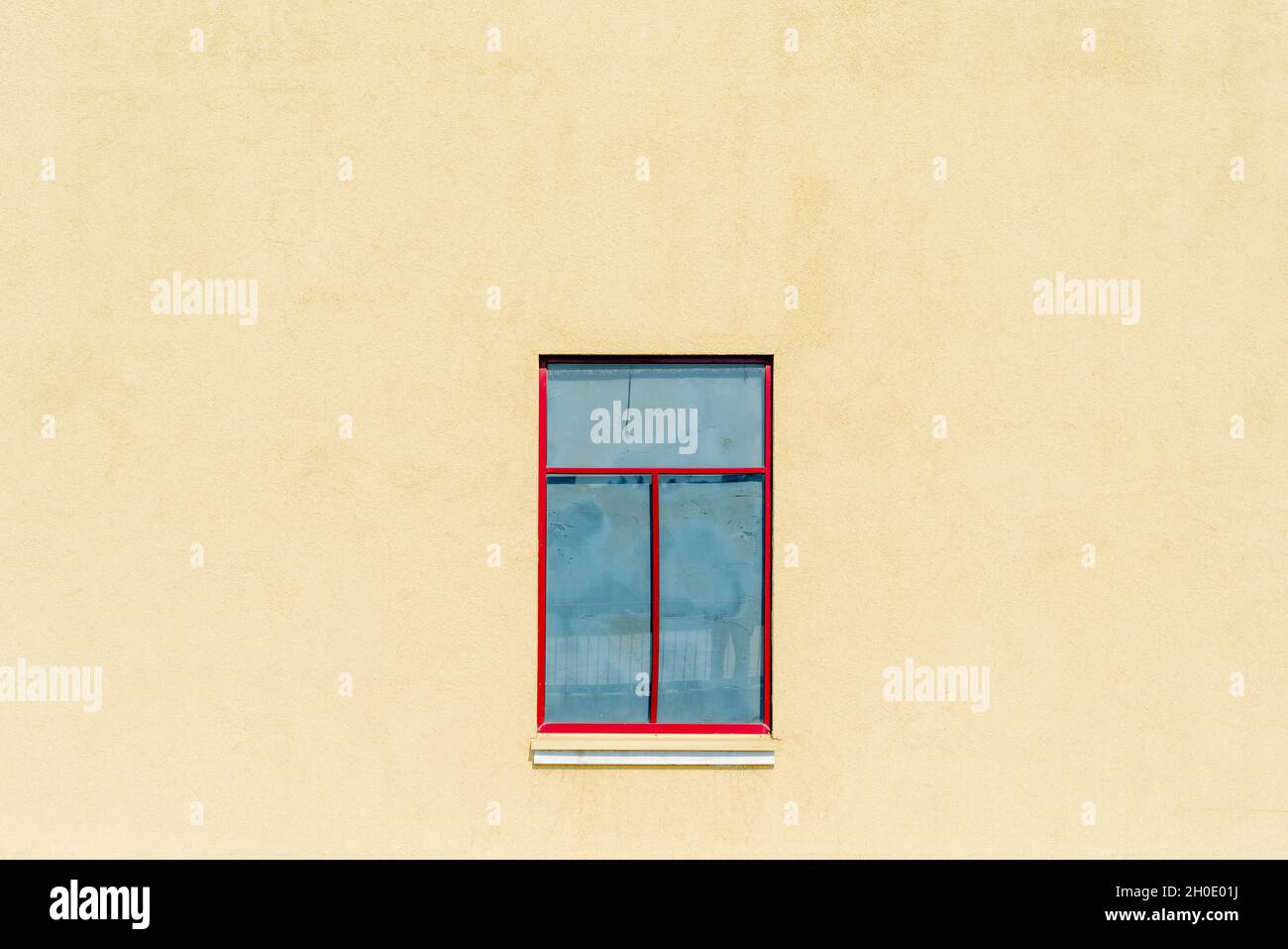 Small window in the yellow wall. Modern architecture Stock Photo - Alamy