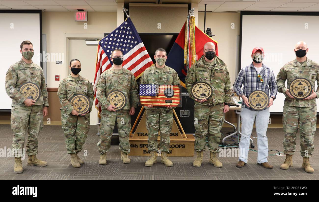 Pictured from left to right: Capt. Eric Domkowski, Sgt. Edith Acevedo ...