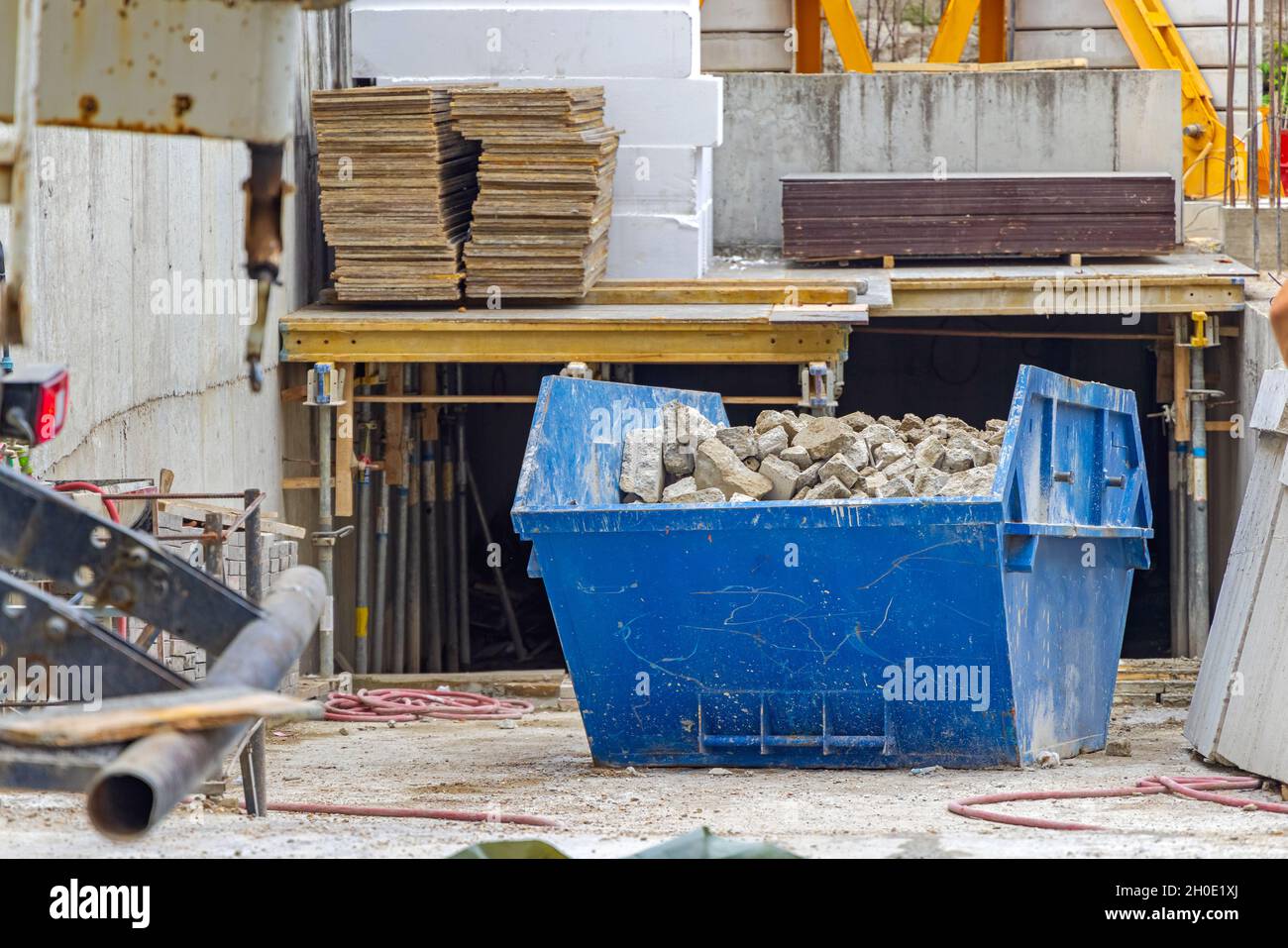 Loaded Skip With Debris at Construction Site Stock Photo - Alamy