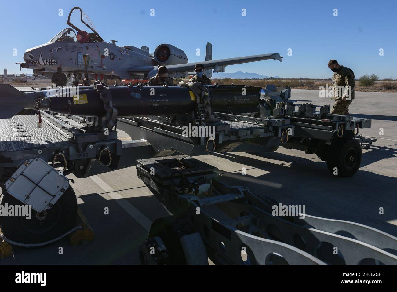 A load crew team performs a bomb load during the annual loading ...