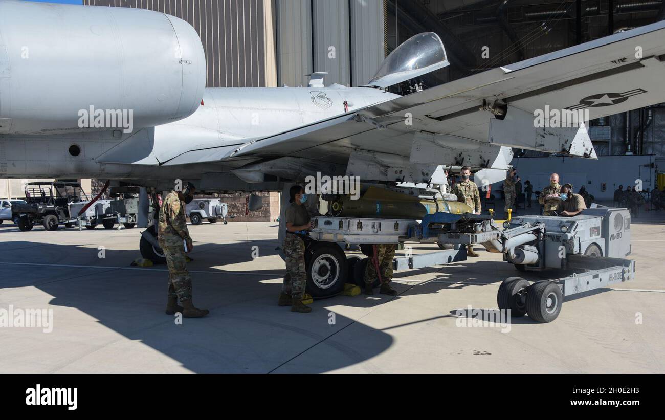 A load crew team performs a bomb load during the annual loading ...