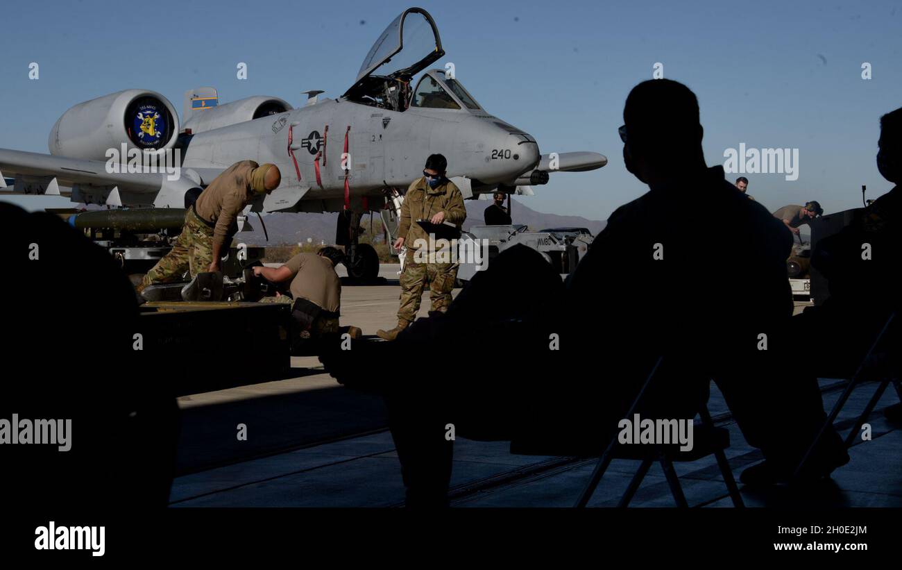 A load crew team performs a bomb load during the annual loading ...