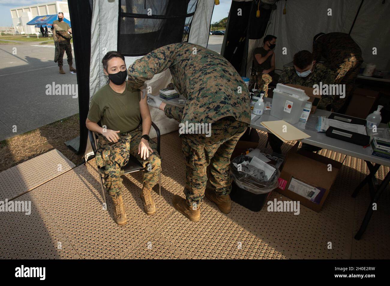 U.S. Marine Corps Lt. Col. Amy Roznowski, left, the operations officer ...