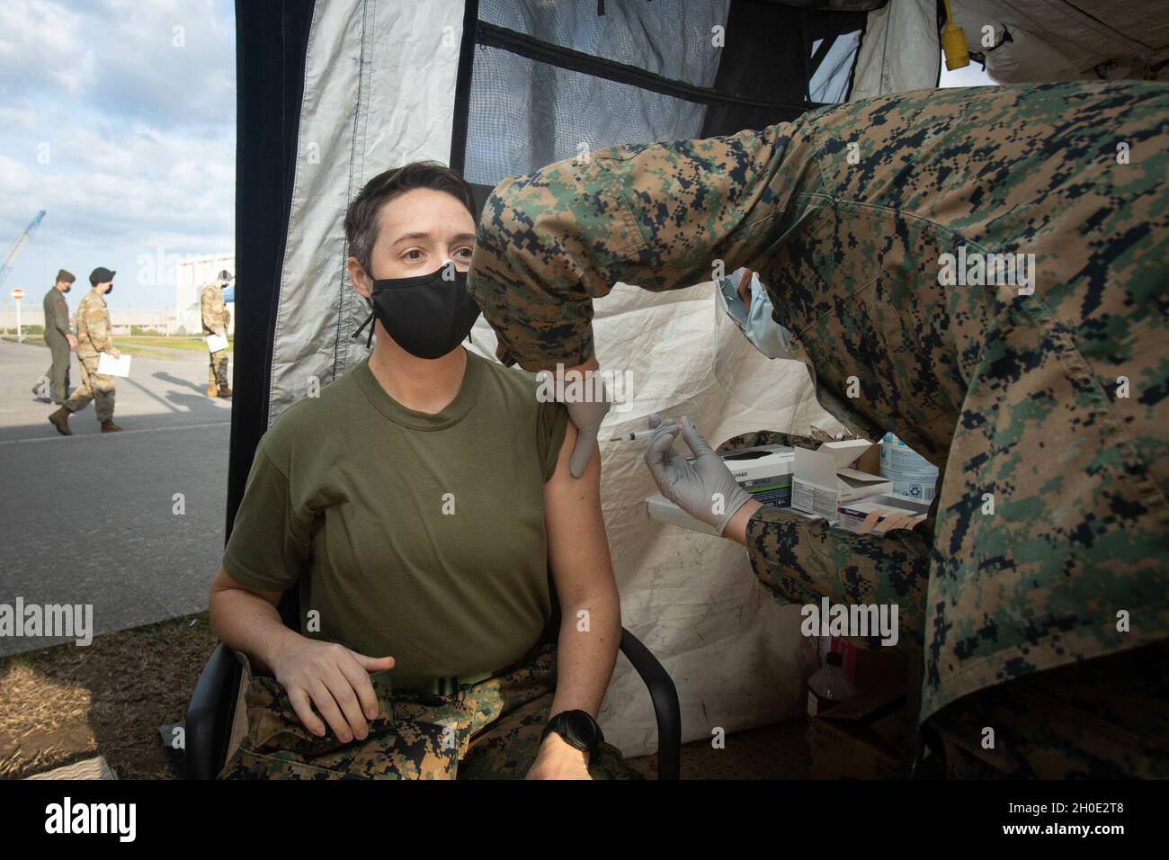 U.S. Marine Corps Lt. Col. Amy Roznowski, left, the operations officer ...