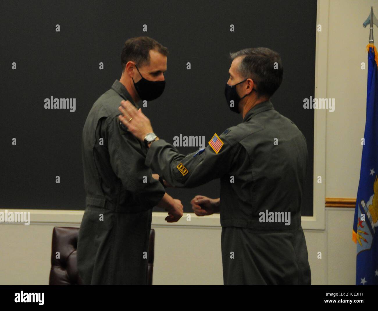 Lt. Col. Jason Allen (right), outgoing commander of the 313th Airlift ...
