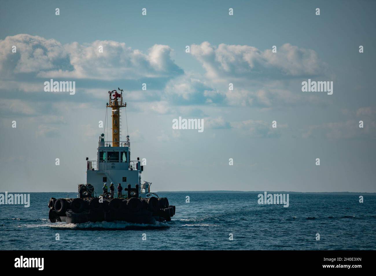 A Japanese barge returns to port to pick up U.S. Marines with Combat ...