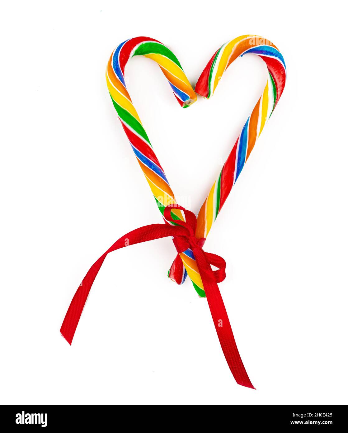 Rainbow colored candy cane isolated on white background Stock Photo - Alamy