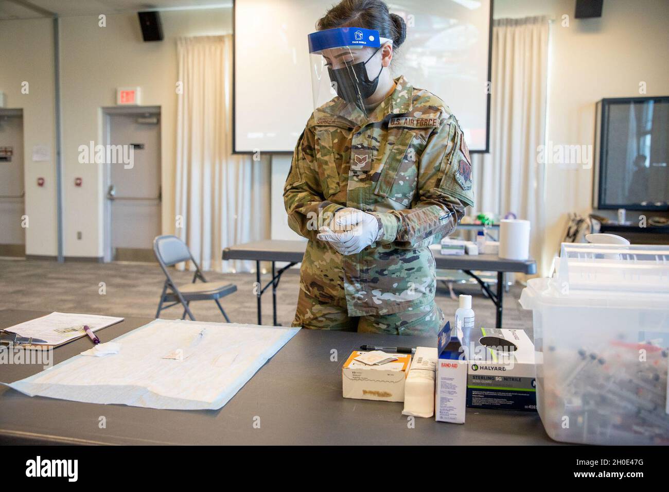 Staff Sgt. Bruna Souza, 102nd Medical Group, prepares to administer a ...