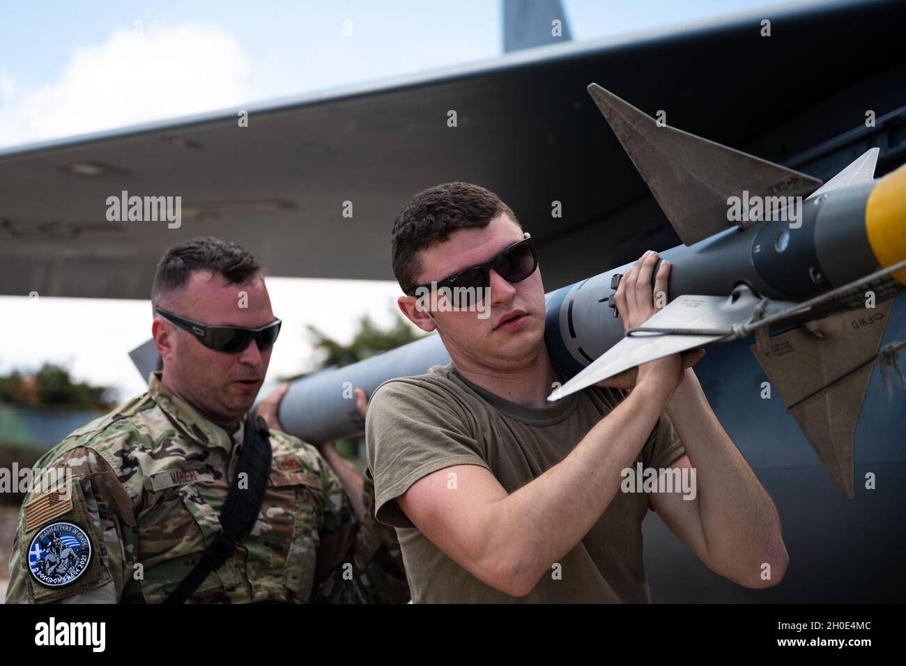U.S. Air Force Senior Airman Victor Faria (right) and Staff Sgt. Brian ...