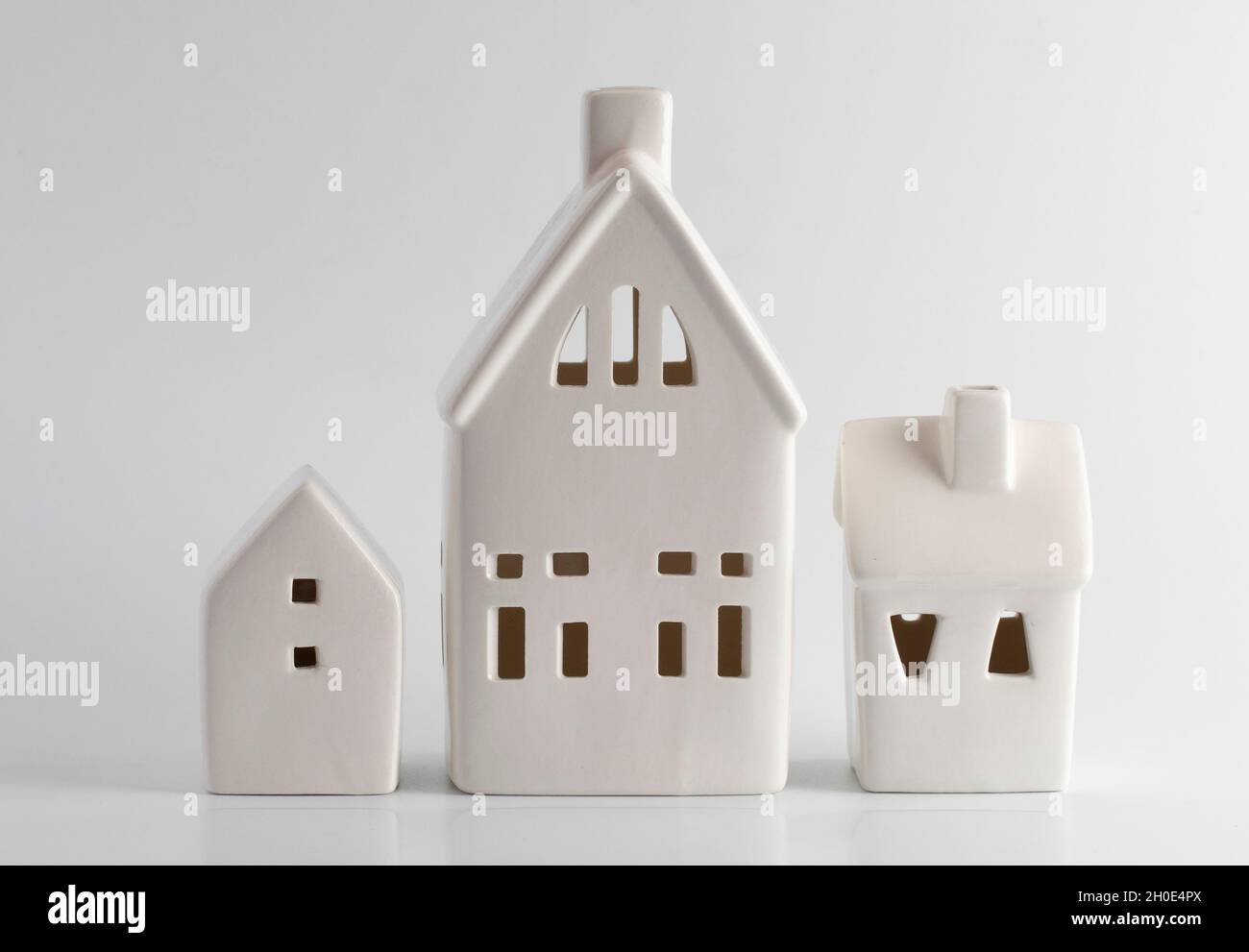 Model Homes in a Row on a White Background Stock Photo - Alamy