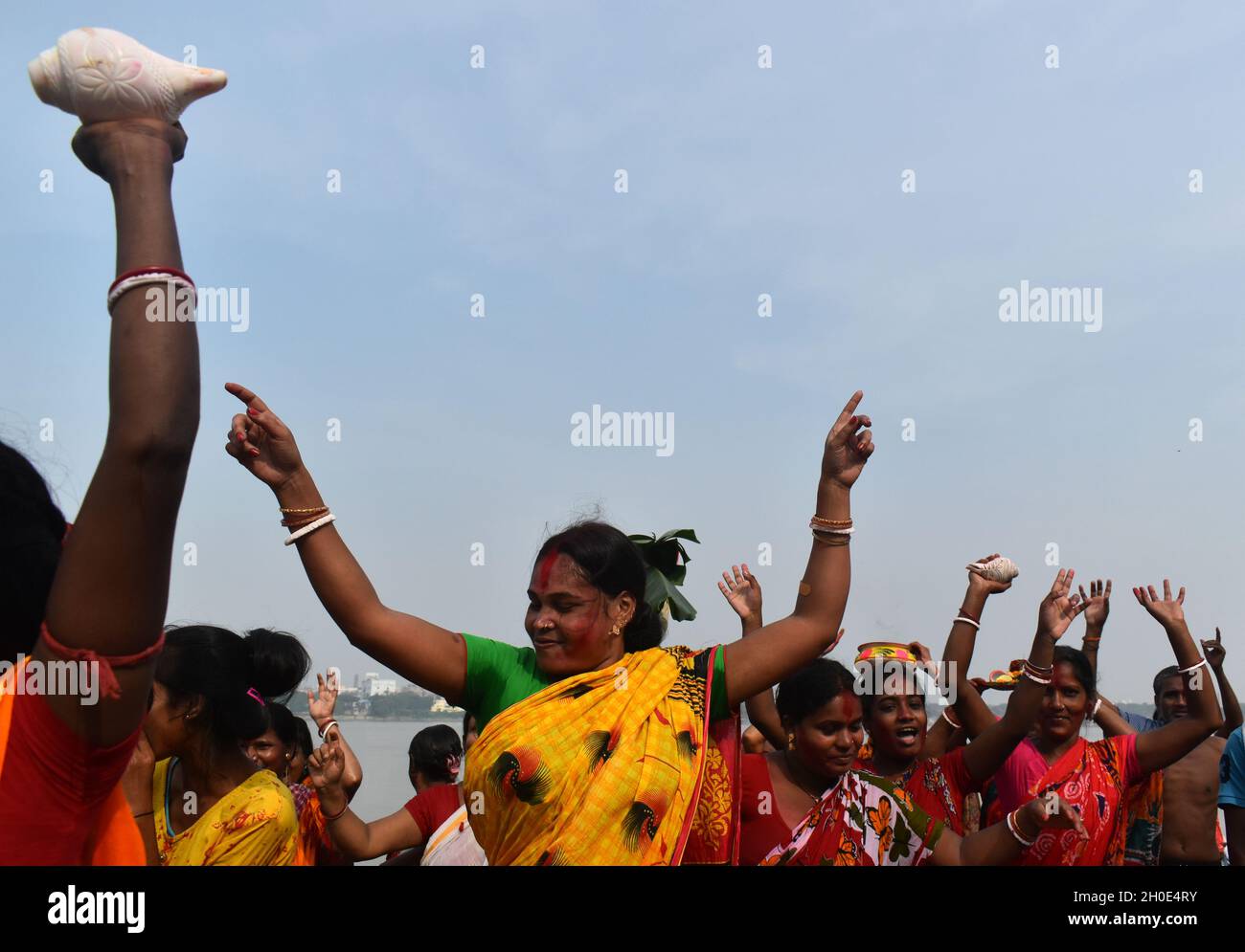 Kolkata, India. 12th Oct, 2021. Hindu devotees dancing before offering ...