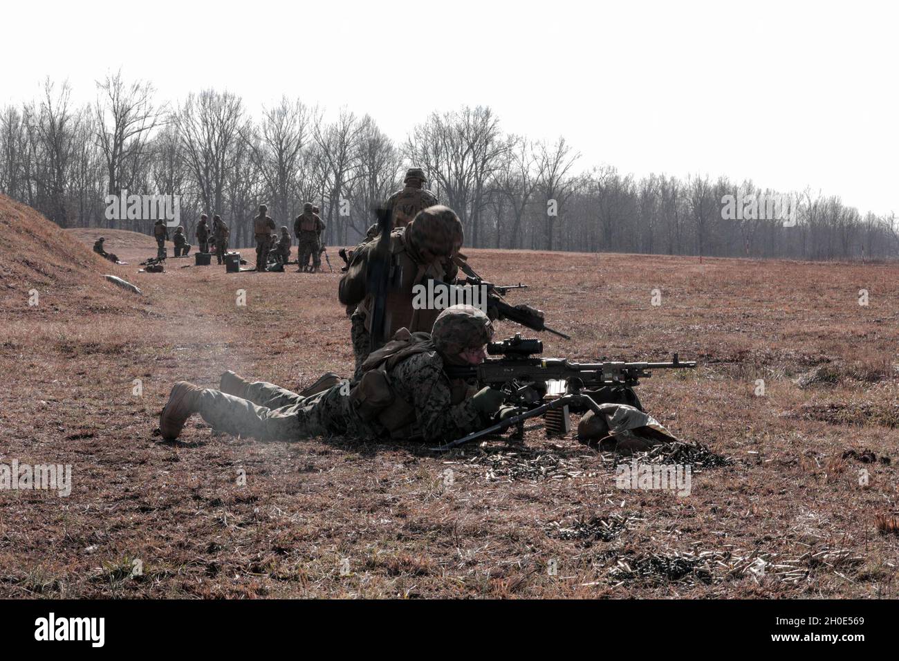U.S. Marines with 3rd Battalion, 23rd Marine Regiment, take aim with a ...