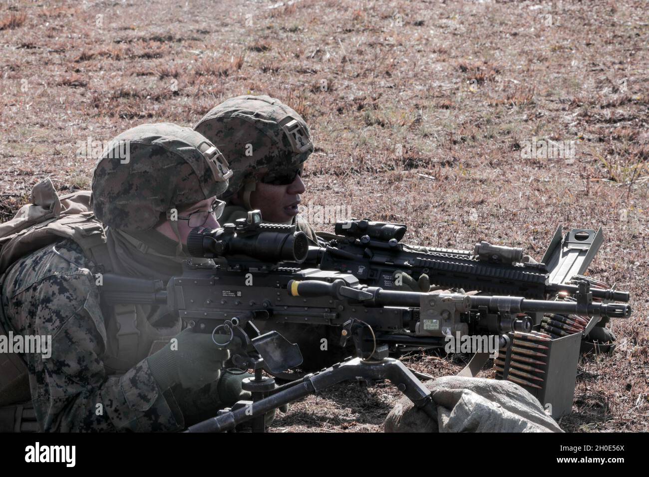 U.S. Marines with 3rd Battalion, 23rd Marine Regiment, take aim with a ...