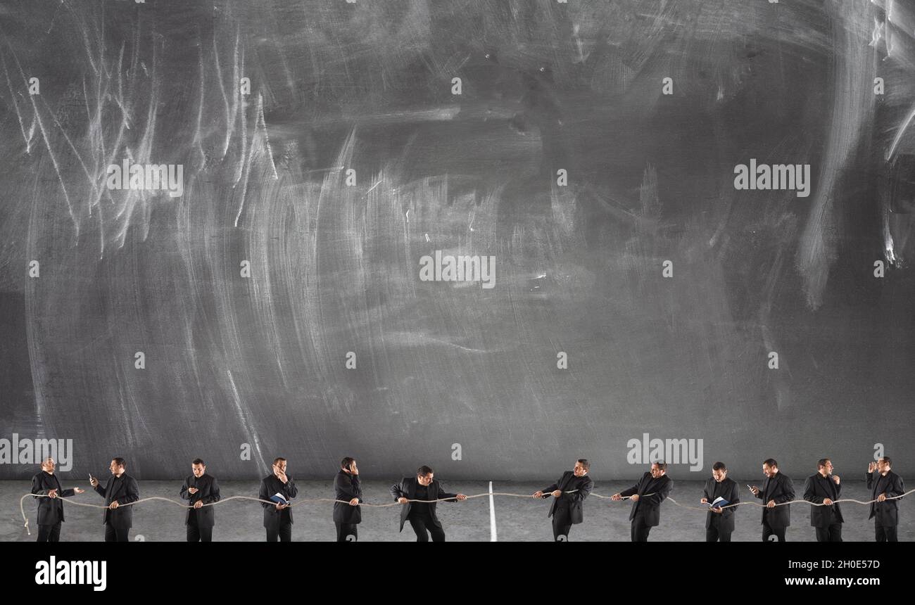 Team competing in tug of war. While some strive and do their duty ...