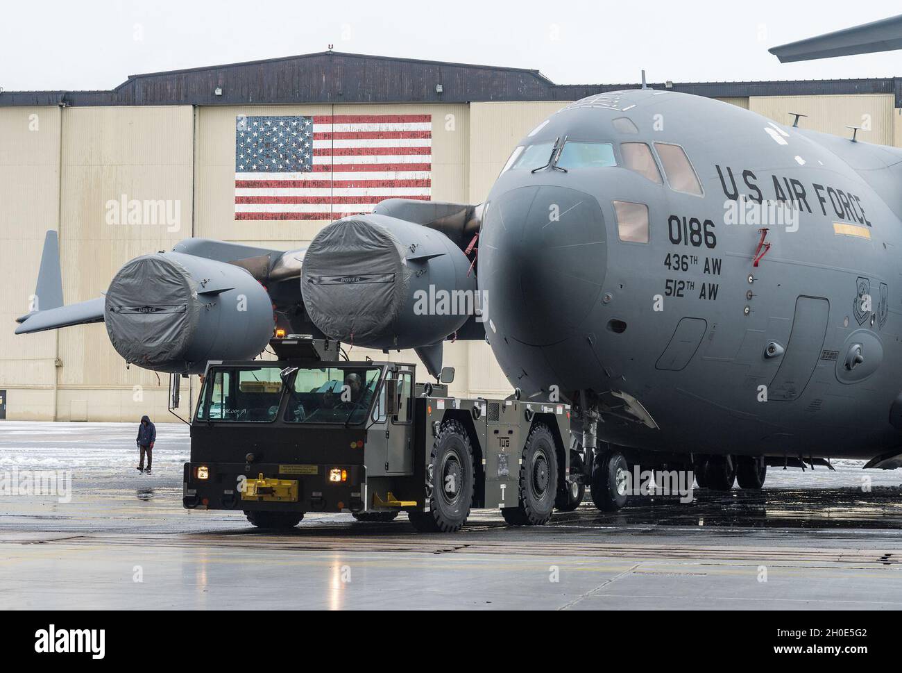 A maintenance tow team from the 736th Aircraft Maintenance Squadron ...