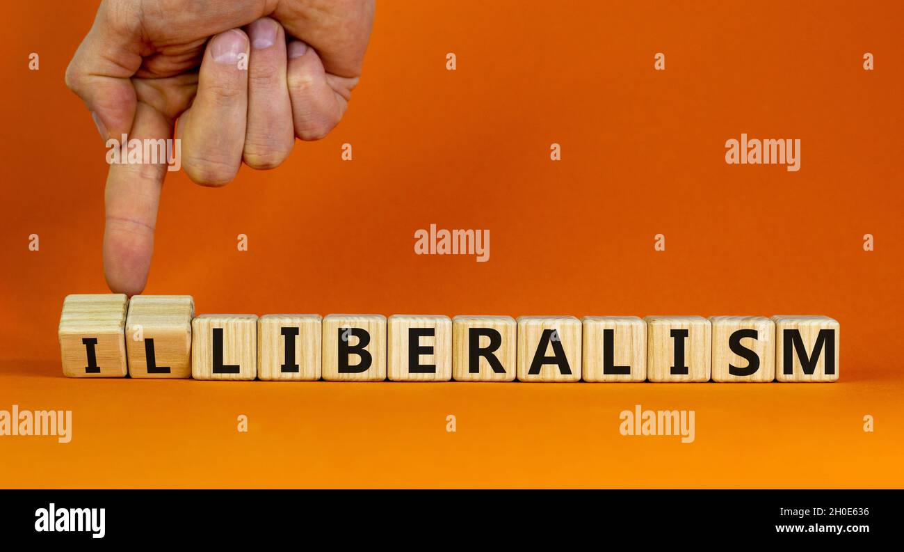 Illiberalism or liberalism symbol. Businessman turns cubes and changes ...