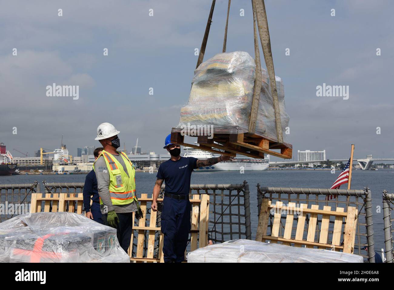 The Coast Guard Cutter Harriet Lane (WMEC-903) crew directs a crane ...