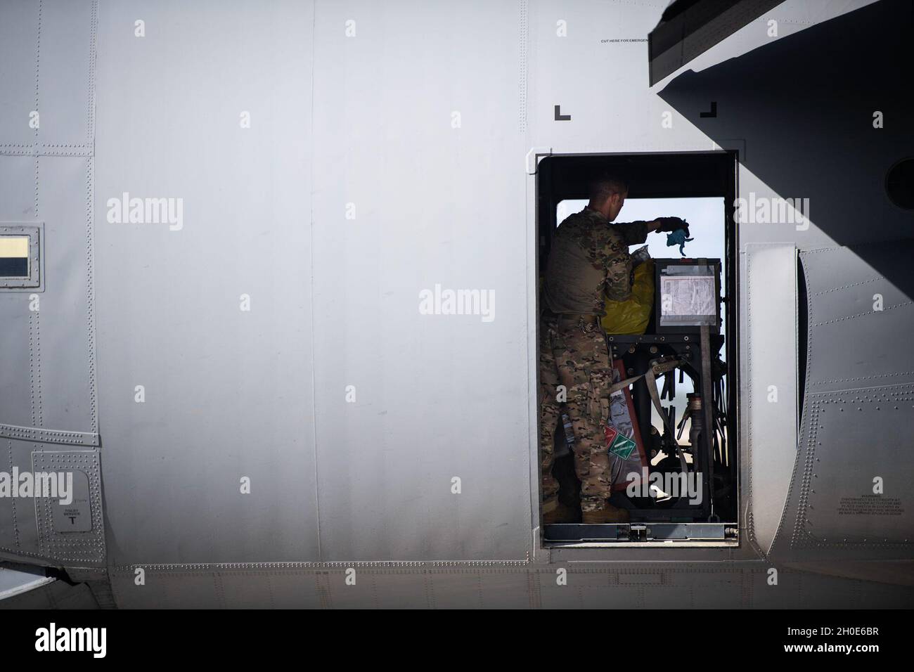 A U.S. Air Force fuels specialist secures the aerial bulk fuel delivery ...