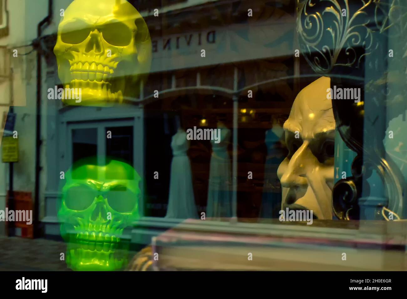 A creepy scene materialises in the reflection of a shop window ...