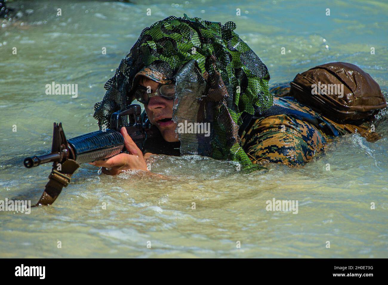 A U.S. Marine with Charlie Company, 1st Battalion, 3d Marines, sights ...