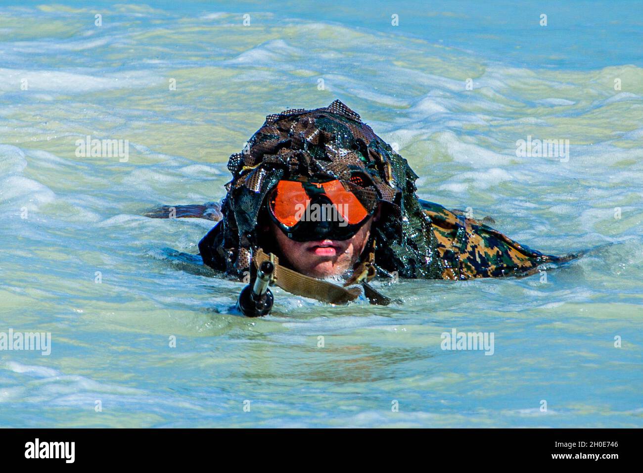 A U.S. Marine with Charlie Company, 1st Battalion, 3d Marines, crawls ...