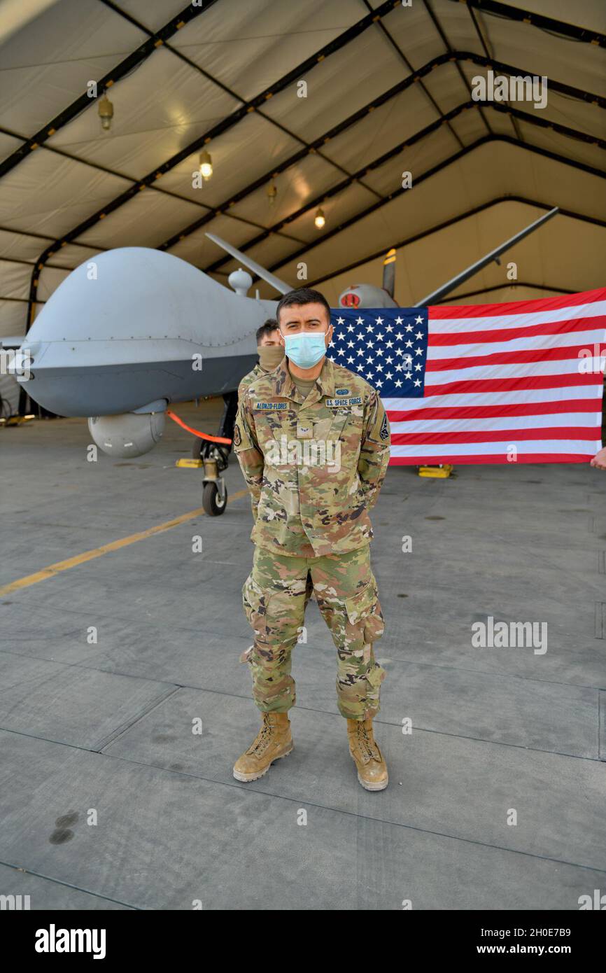 A servicemember from the 332 Air Expeditionary Wing Force Protection ...