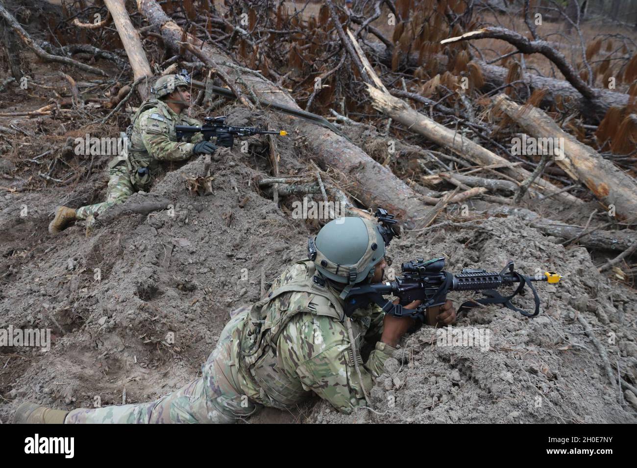 Two 3-82nd Soldiers, behind embankment pull security during JRTC RTN 21 ...