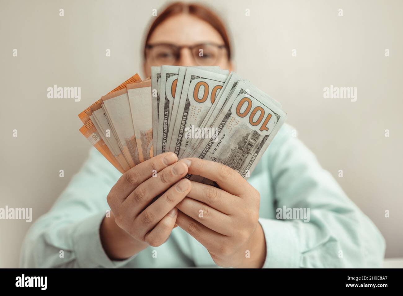 Happy business woman covering her face with money. Money winner Stock ...