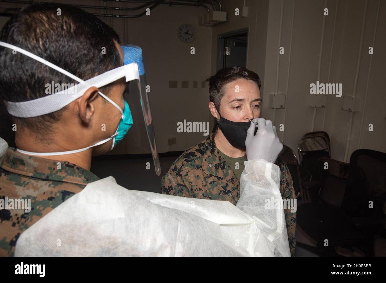 U.S. Marine Corps Lt. Col. Amy Roznowski, left, the operations officer ...