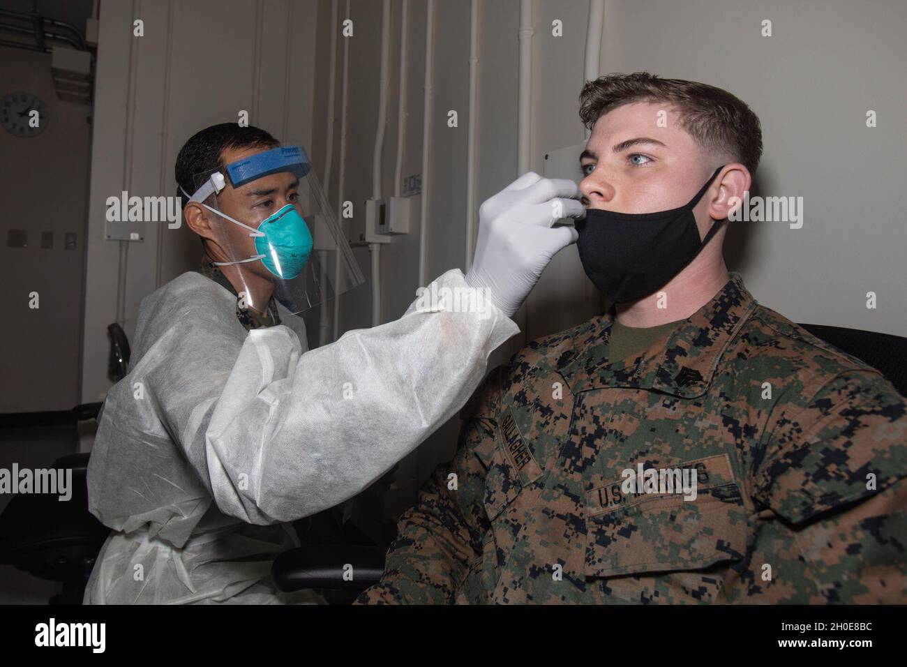 U.S. Navy Hospital Corpsman 2nd Class Rommel Samson, right, a task ...