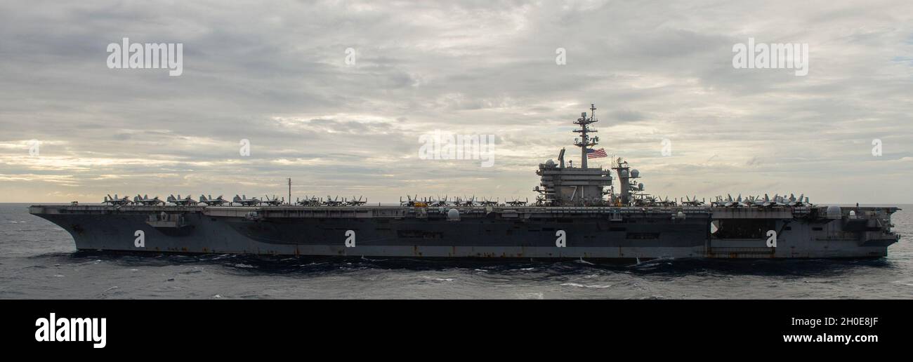 210209-N-EB640-1254 SOUTH CHINA SEA (Feb. 9, 2021) USS Theodore Roosevelt (CVN 71) steams ...