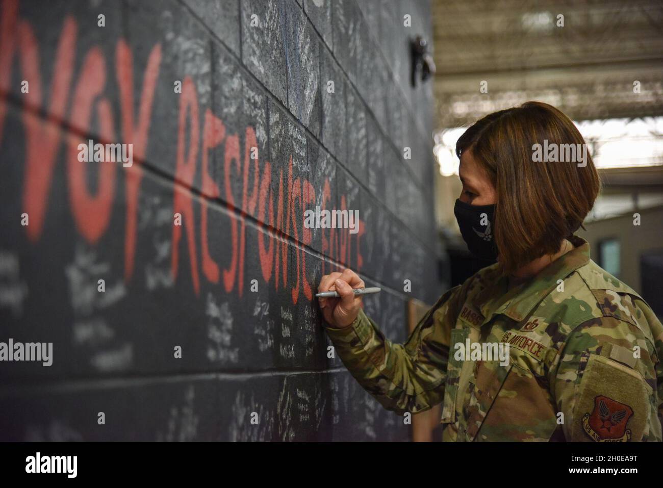 Chief Master Sgt. of the Air Force JoAnne S. Bass signs the 341st ...