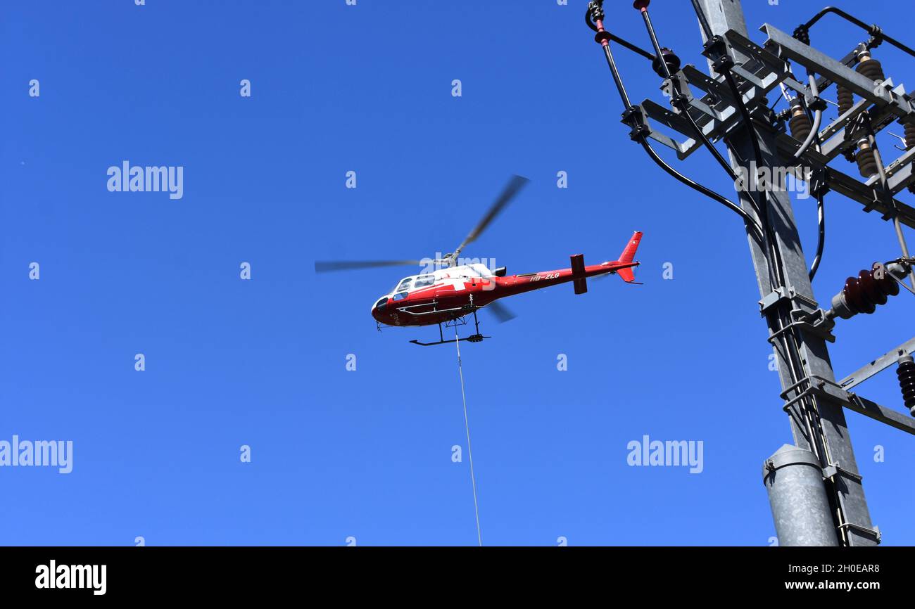 Helicopter at work Stock Photo - Alamy
