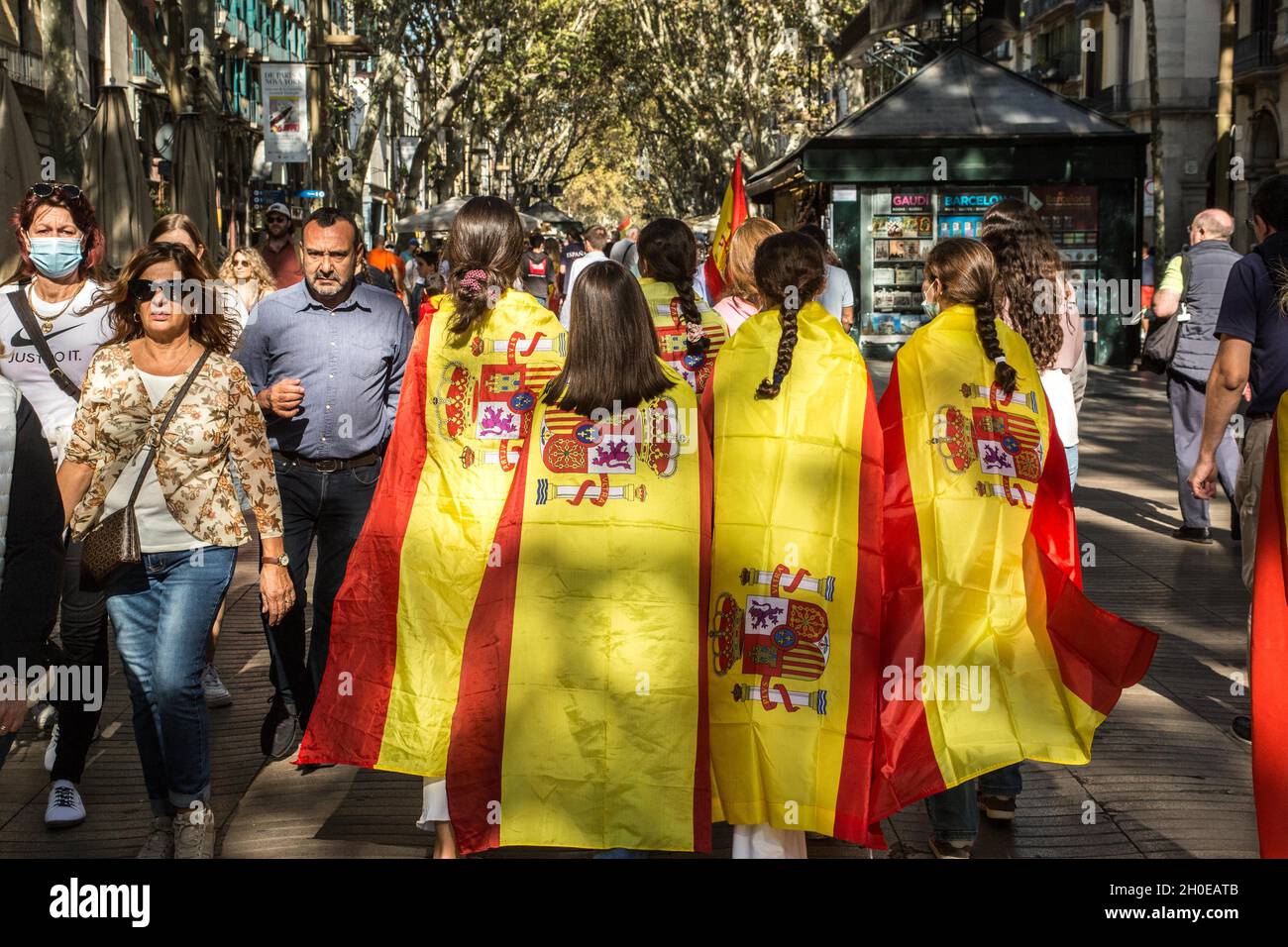 People are seen with Spanish flags on the Hispanic Day on the Rambla in ...