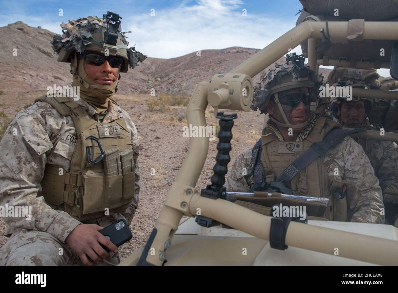 U.S. Marine Corps Marine CWO3 Kyle Costanzo, the infantry weapons officer, left, and Lt. Col ...