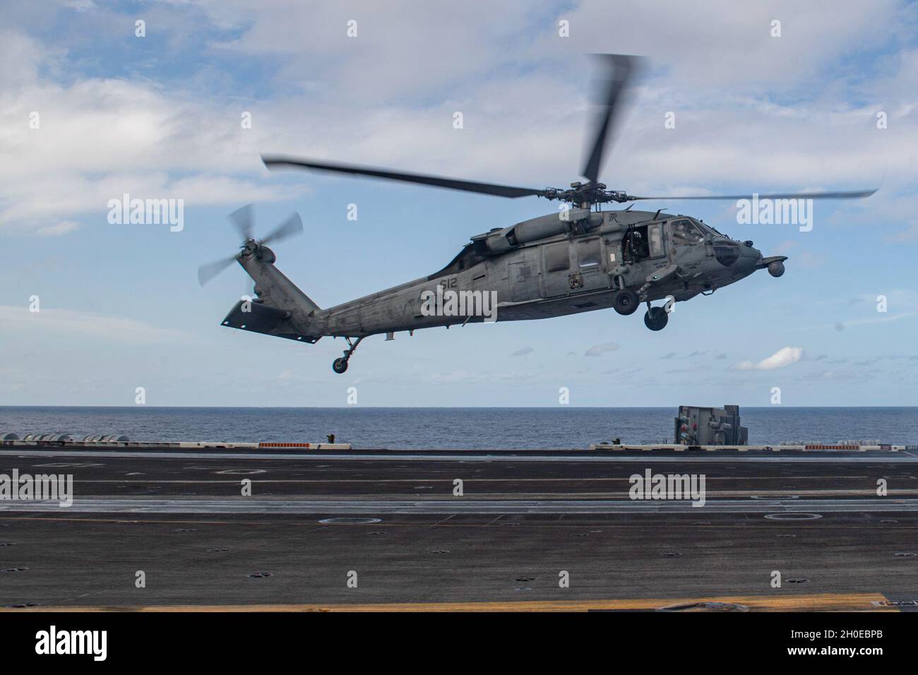SOUTH CHINA SEA (Feb. 10, 2021) An MH-60S Sea Hawk, assigned to the ...