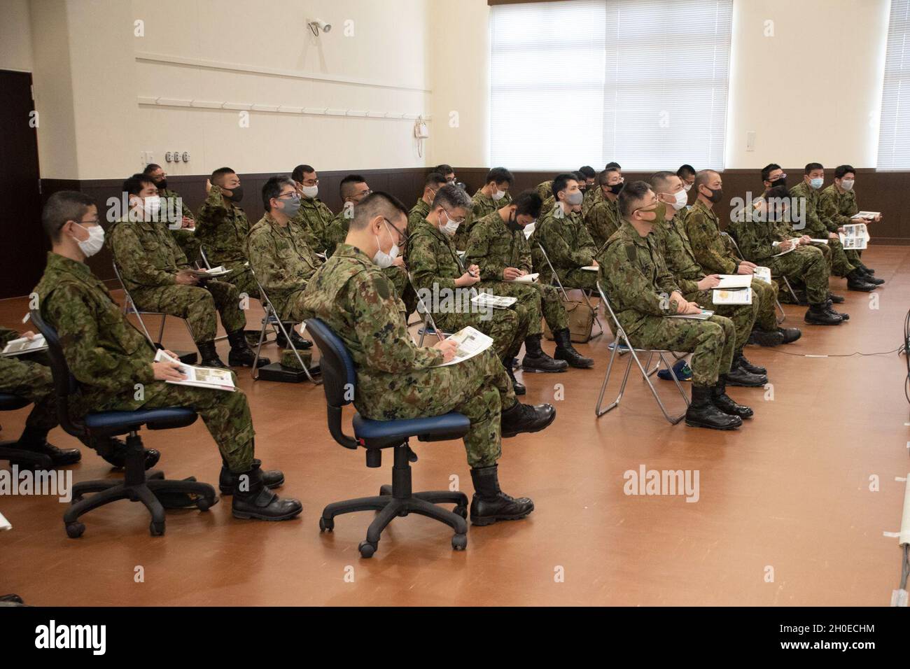 Japan Ground Self Defense Force soldiers listen to a presentation from ...