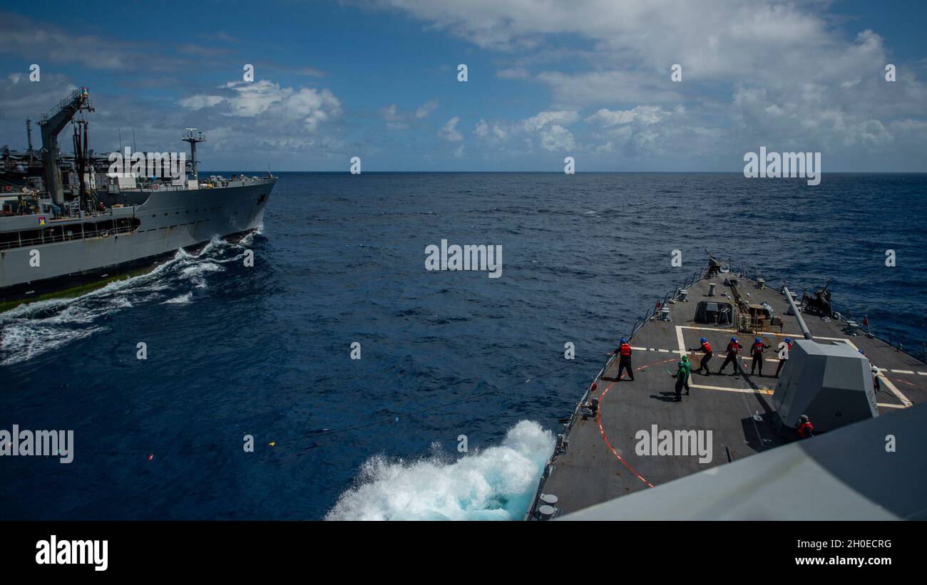 SOUTH CHINA SEA (Feb. 10, 2021) U.S. Sailors hold the phone and ...