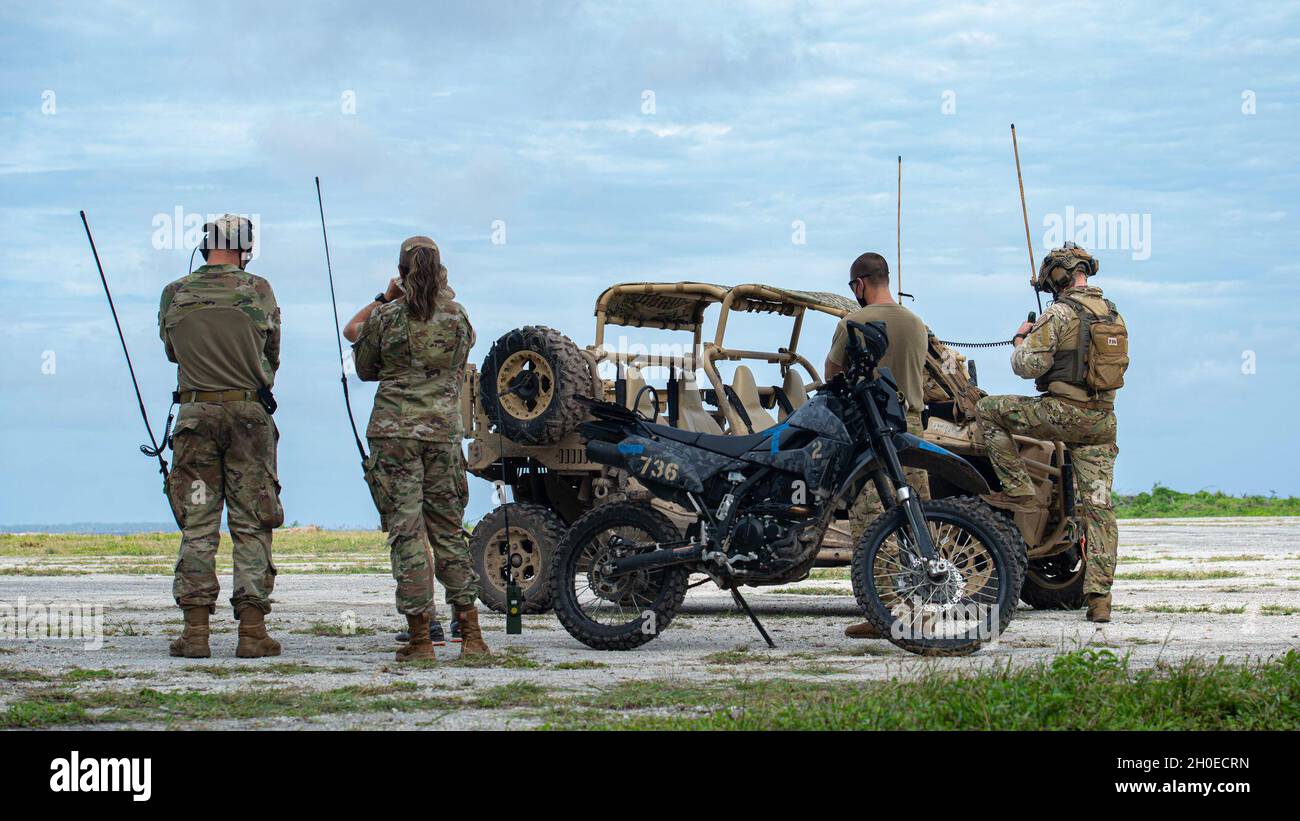 Members of the 36th Contingency Response Group await an incoming ...