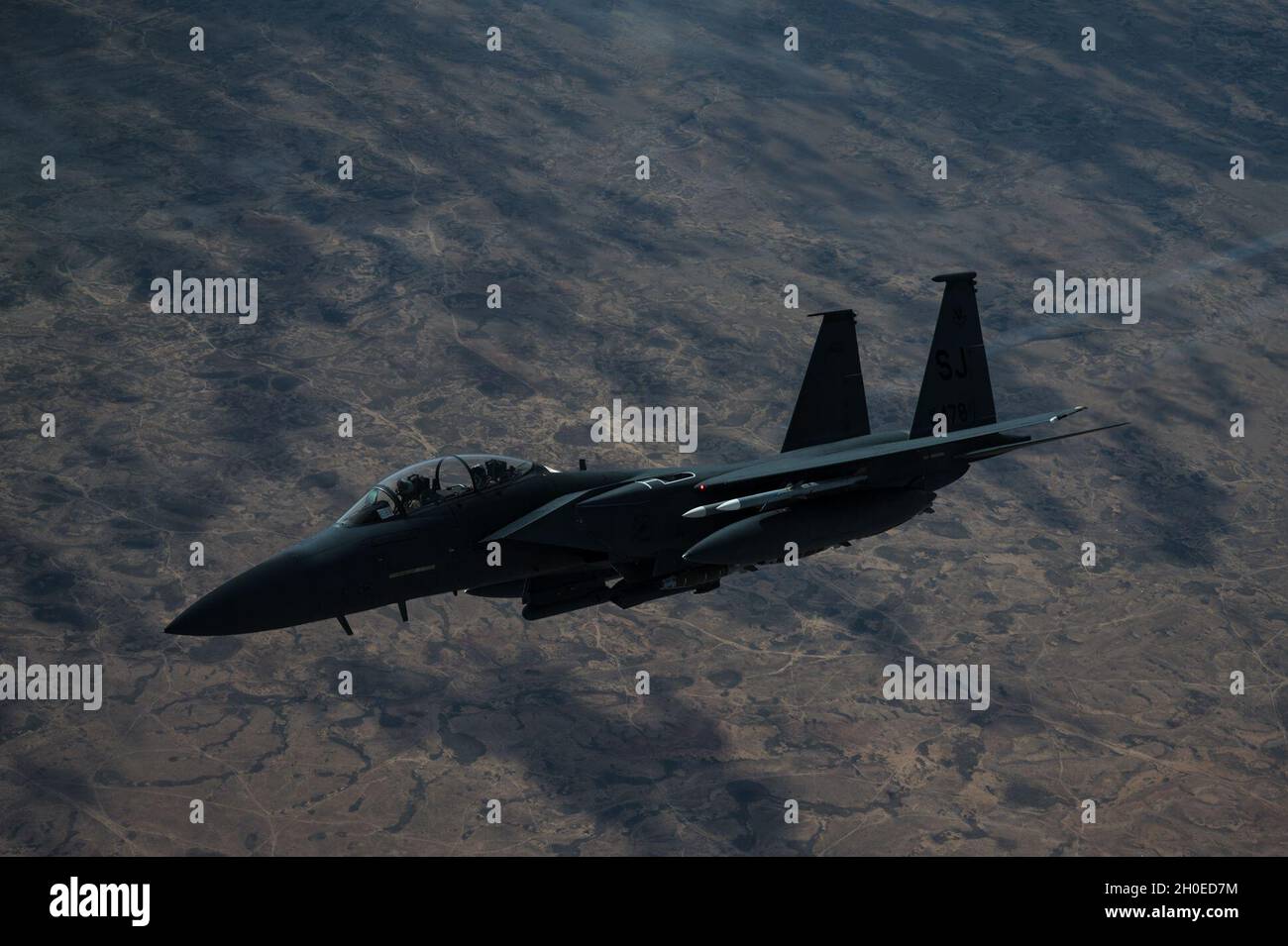 A U.S. Air Force F-15 Strike Eagle flies over the U.S. Central Command ...