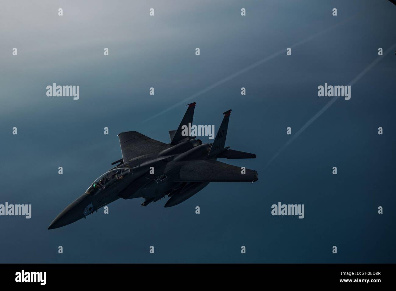 A U.S. Air Force F-15 Strike Eagle flies over the U.S. Central Command ...