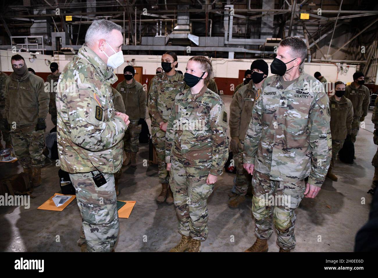 Maj. Gen. Dennis LeMaster, MEDCoE Commanding General, presents a coin ...