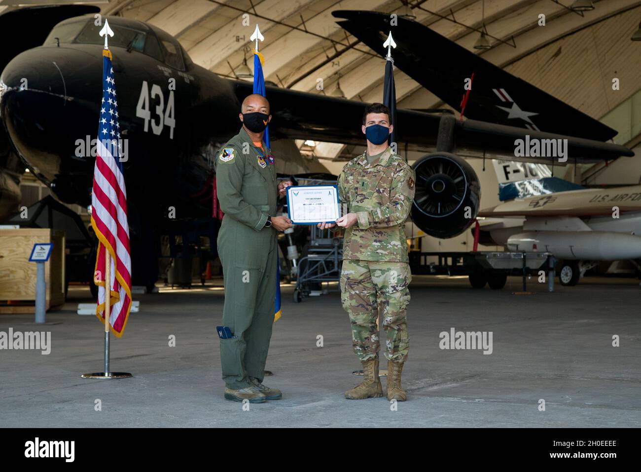 1st Lt. Brendan Ruchlin, 418th Flight Test Squadron, accepts his U.S ...