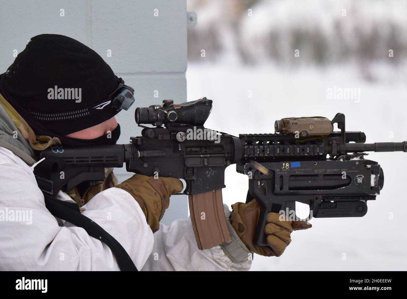 An opposing force soldier fires at attacking paratroopers from C ...